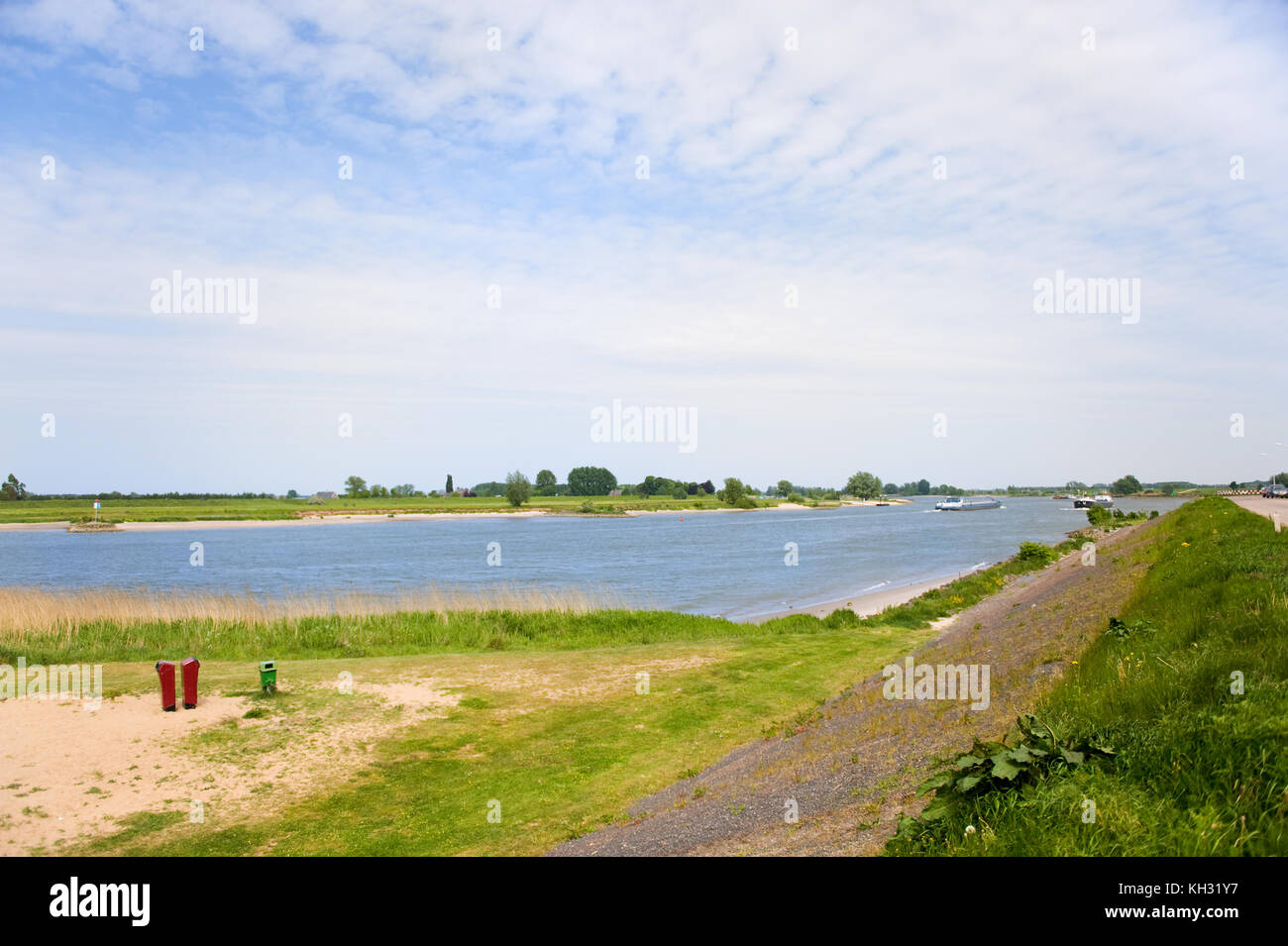 Dutch river landscape with boats and dike Stock Photo - Alamy