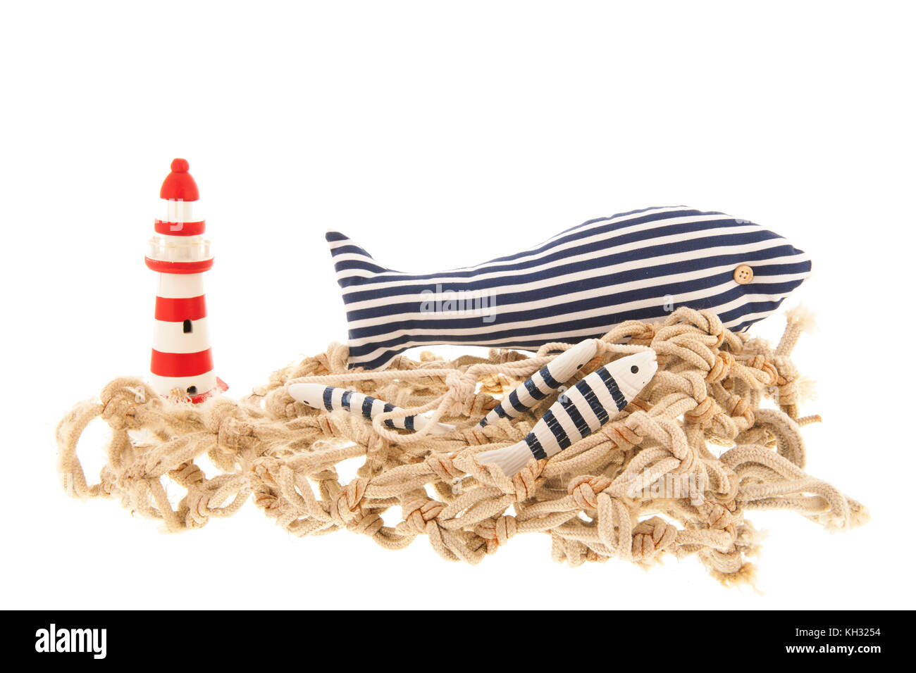 Fishing net with lighthouse and artificial fish Stock Photo - Alamy