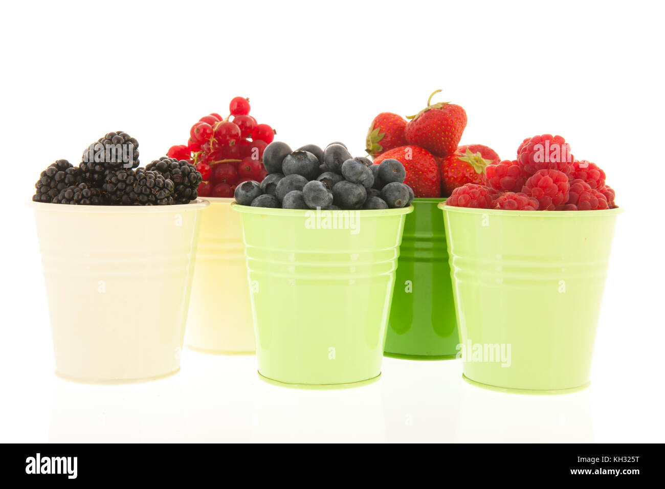 Little buckets with assortment soft fruit isolated over white ...
