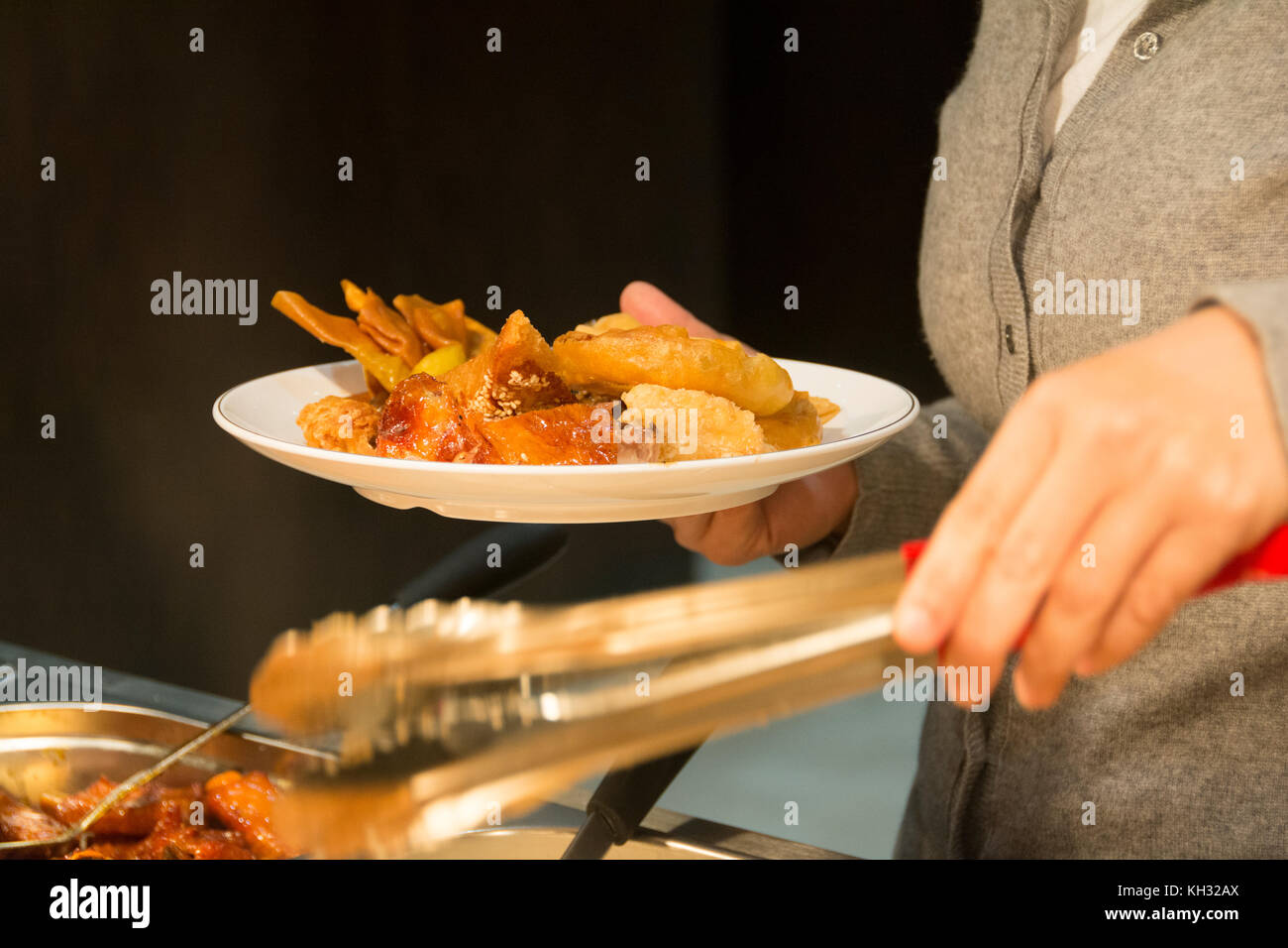 Customers helping themselves to food in a Chinese restaurant in China ...