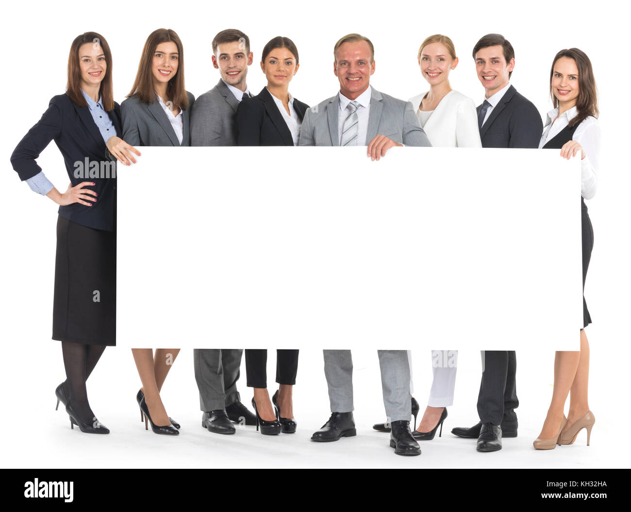 Group of business people holding a banner ad isolated on white Stock ...