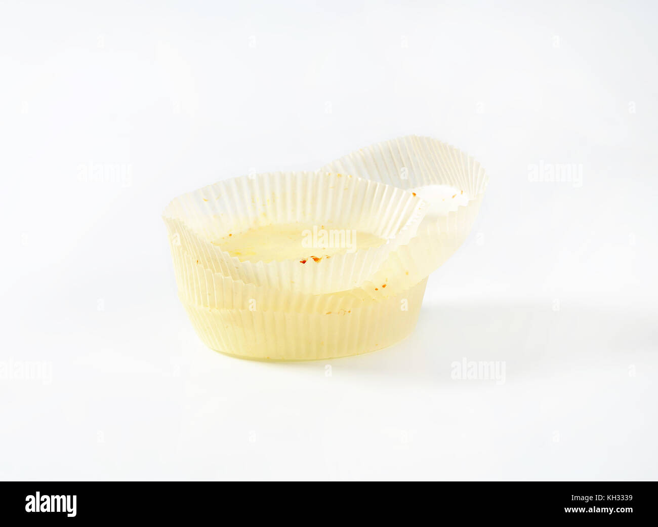 empty paper cupcakes cases on white background Stock Photo - Alamy