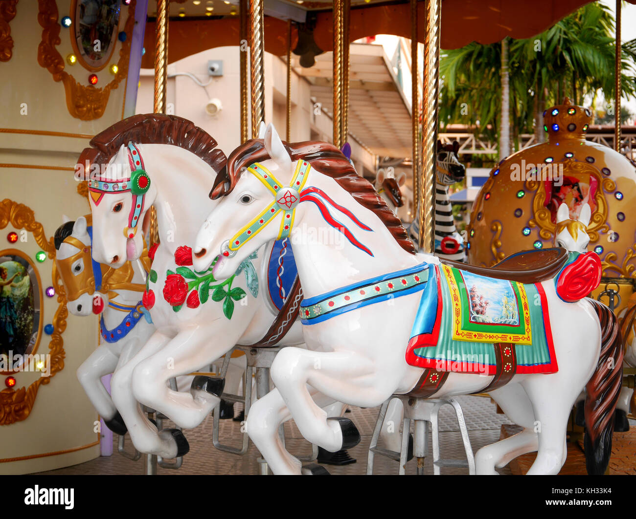 White horse carousel Stock Photo - Alamy