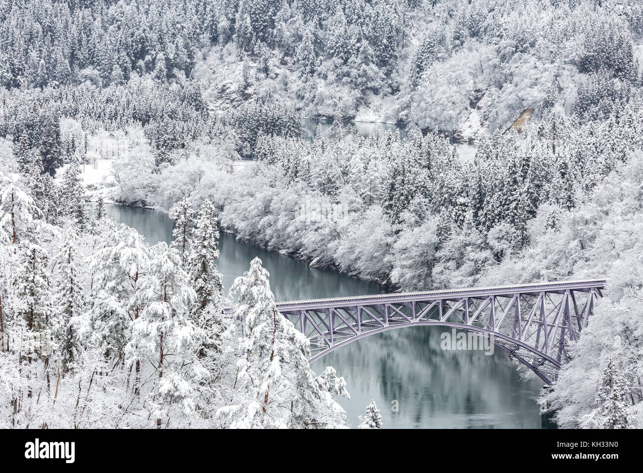 Winter landscape snow covered trees with train crossin River on Bridge ...