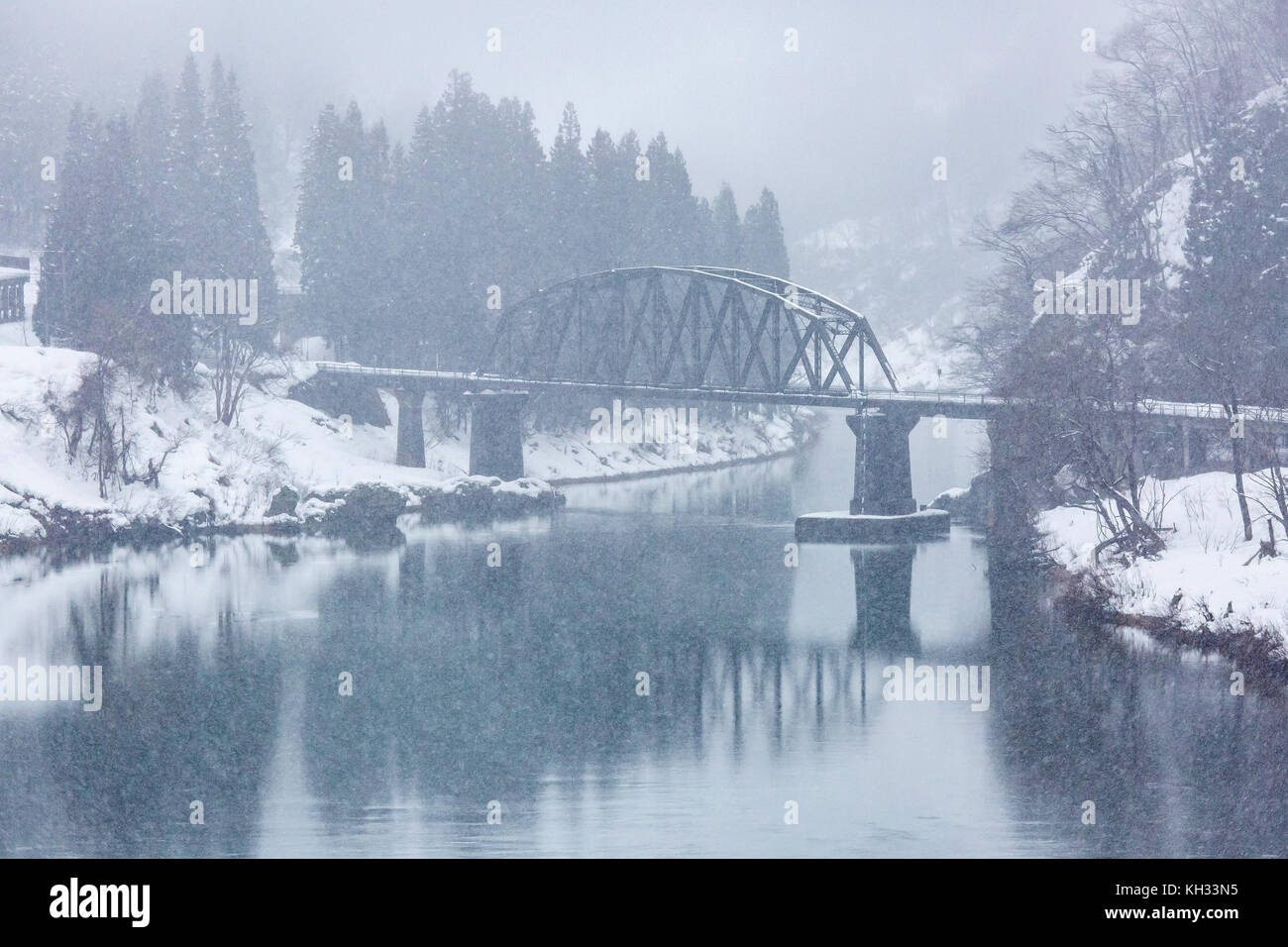 Train in Winter landscape snow on bridge Stock Photo - Alamy