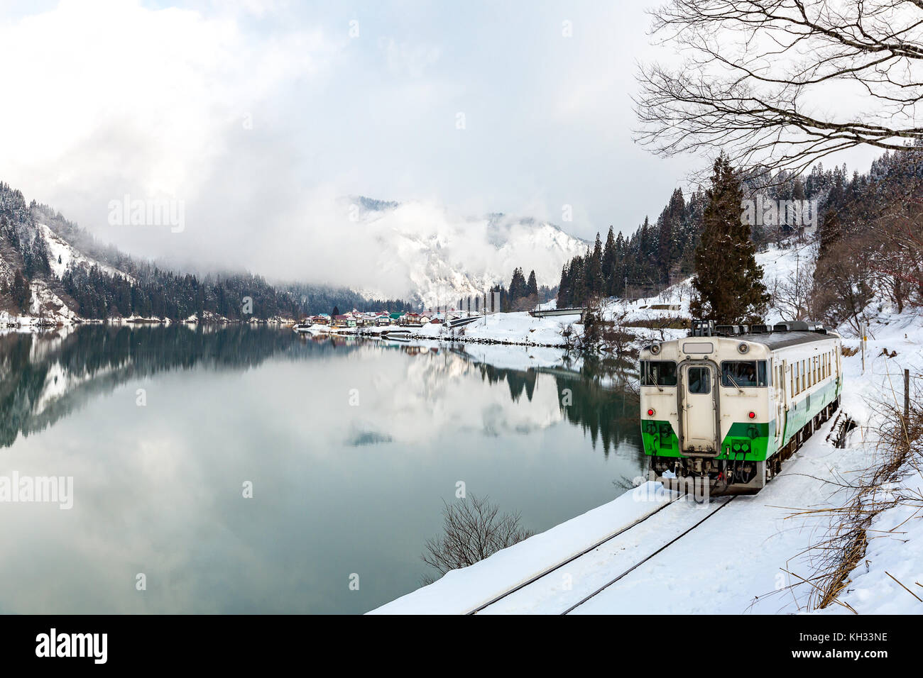 Train in Winter landscape snow on bridge Stock Photo - Alamy