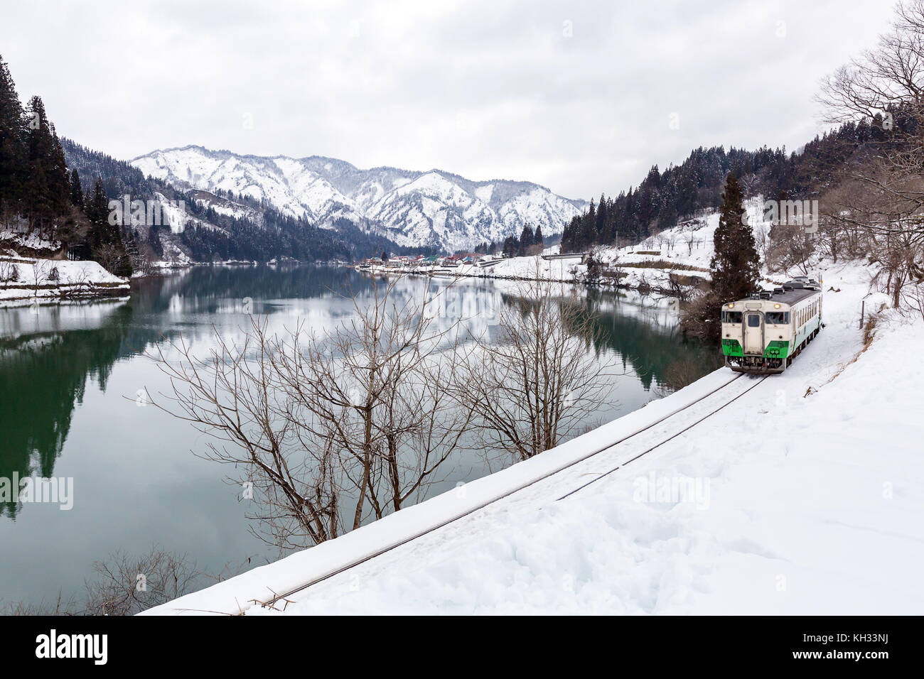 Train in Winter landscape snow on bridge Stock Photo - Alamy