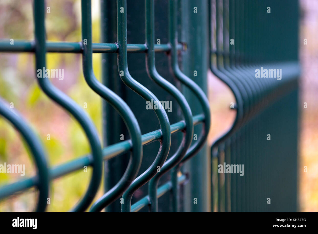 Close-up of dark green fence Stock Photo - Alamy
