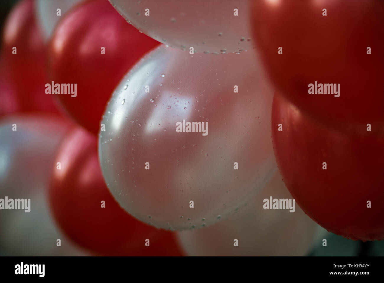 White and red balloons with rain drops Stock Photo - Alamy
