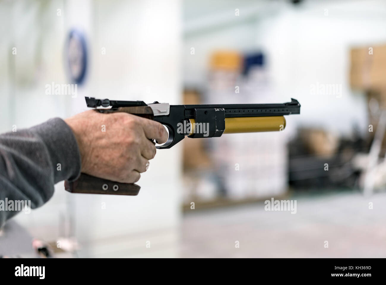 Aiming the target and Shooting with Pistol, Indoors Stock Photo - Alamy