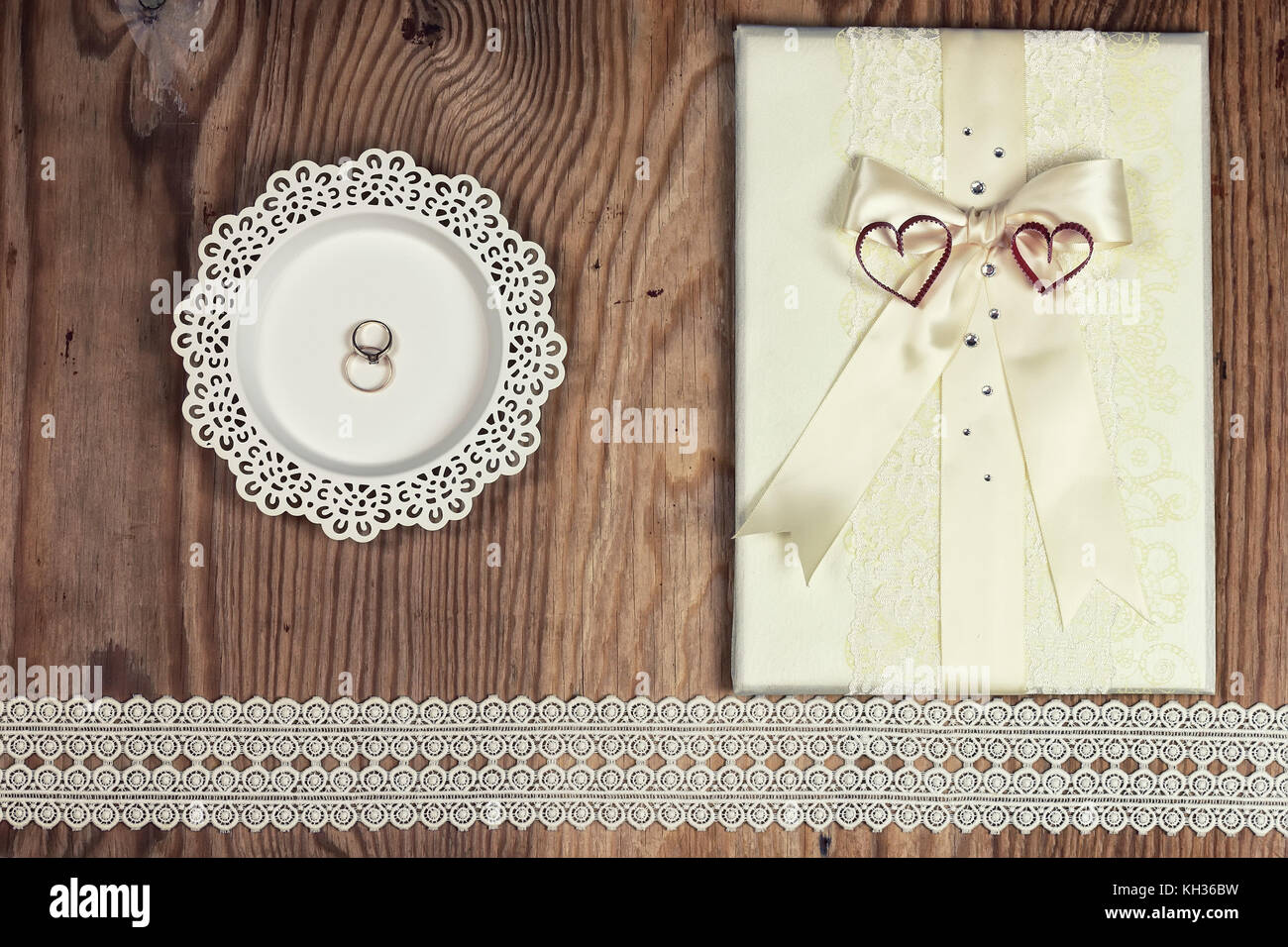 wedding ring invitation wood background Stock Photo - Alamy
