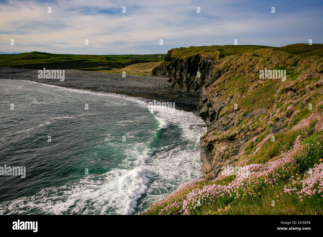 Cliffs along the Doolin Cliff Walk Trial sitting below Doonagore Castle ...
