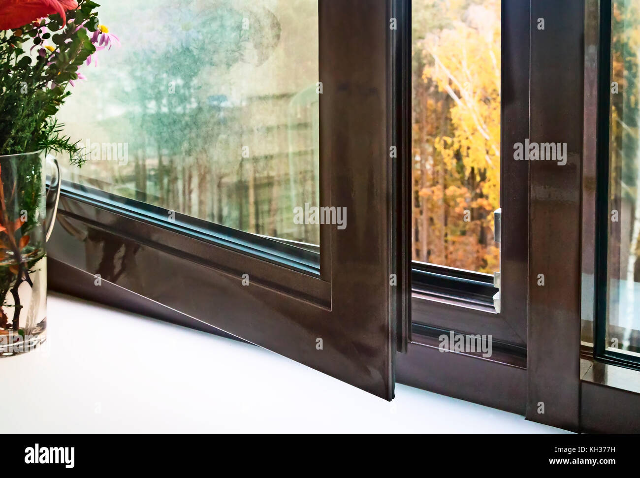 Open window with brown frames and views of autumn landscape Stock Photo ...