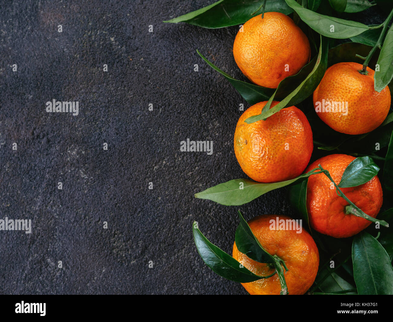Tangerines, oranges, mandarins, clementines, citrus fruits with leaves ...