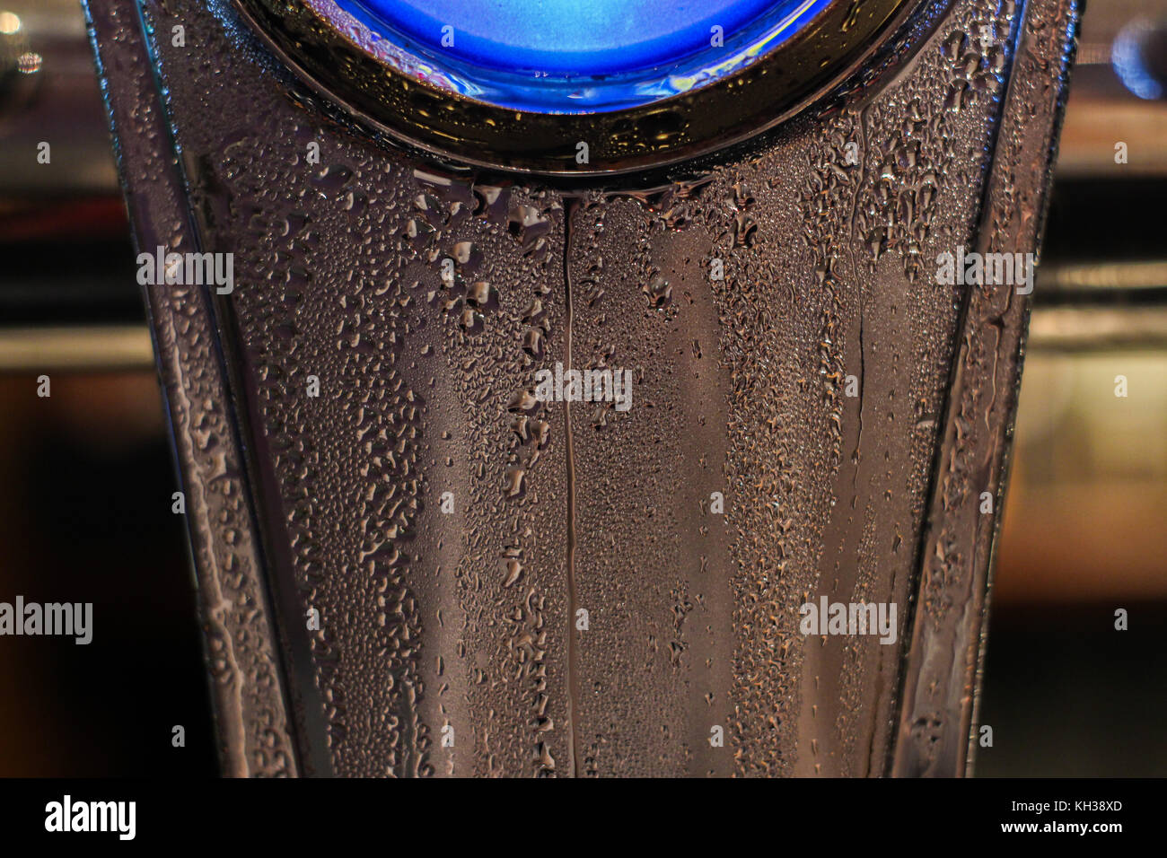 Water droplets on a T bar in a pub Stock Photo - Alamy