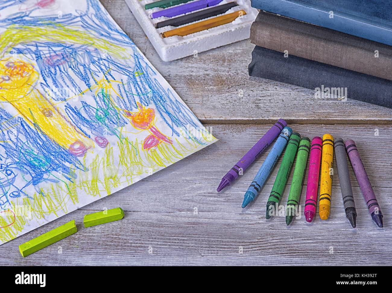 Child painting in the preschool with crayons Stock Photo - Alamy