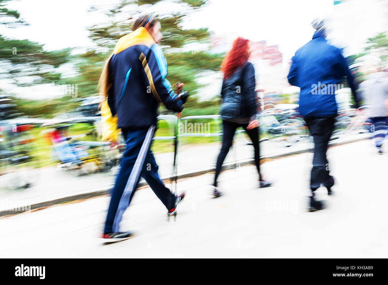 picture of wandering people in motion blur Stock Photo - Alamy