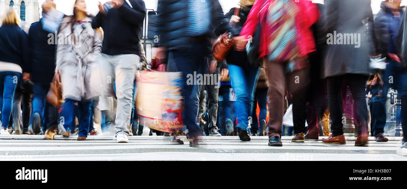 picture of crowds of people in motion blur crossing a city street Stock ...