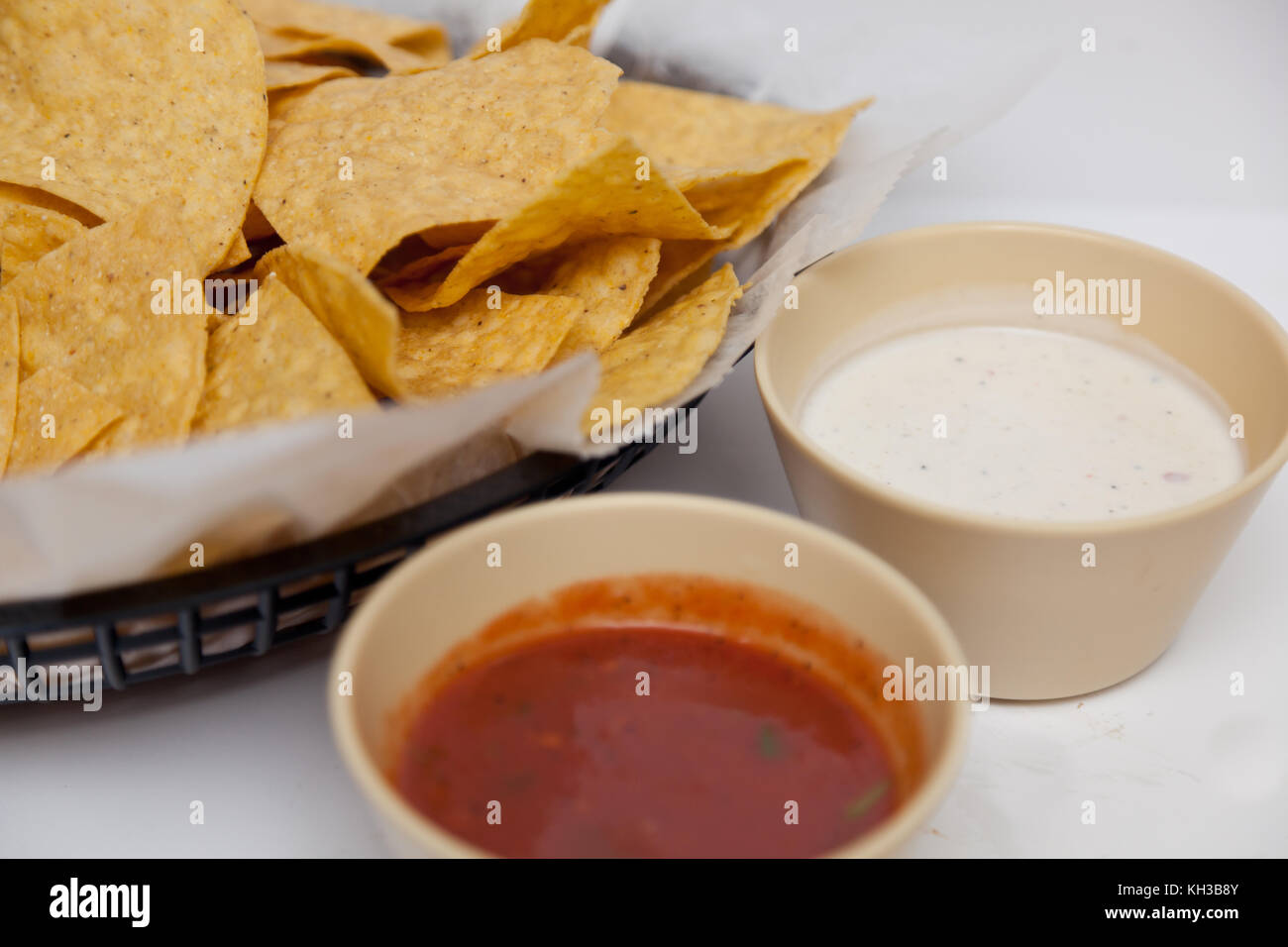 Tostada Chips and two kinds of dip Stock Photo - Alamy