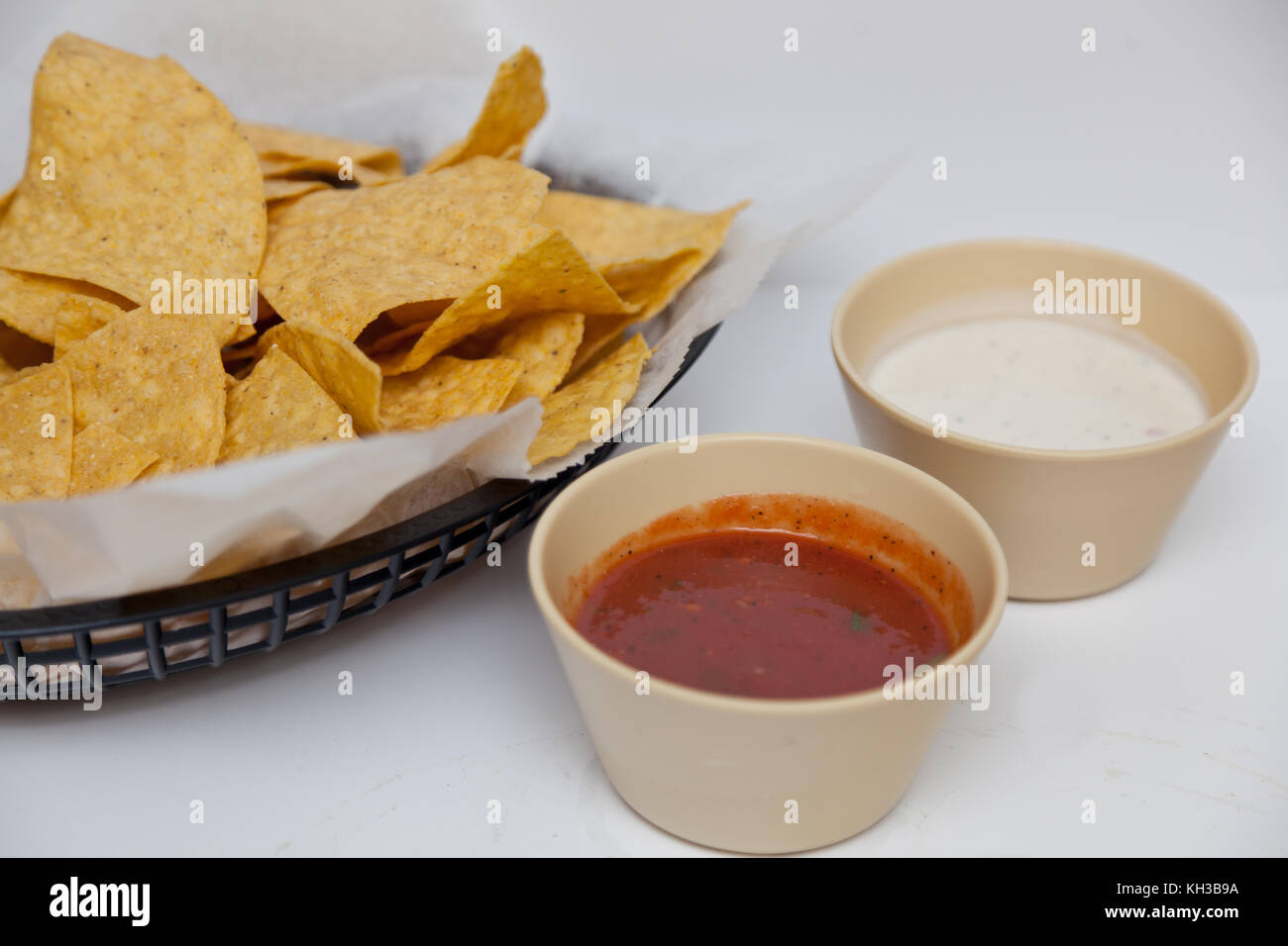 Tostada Chips and two kinds of dip Stock Photo - Alamy