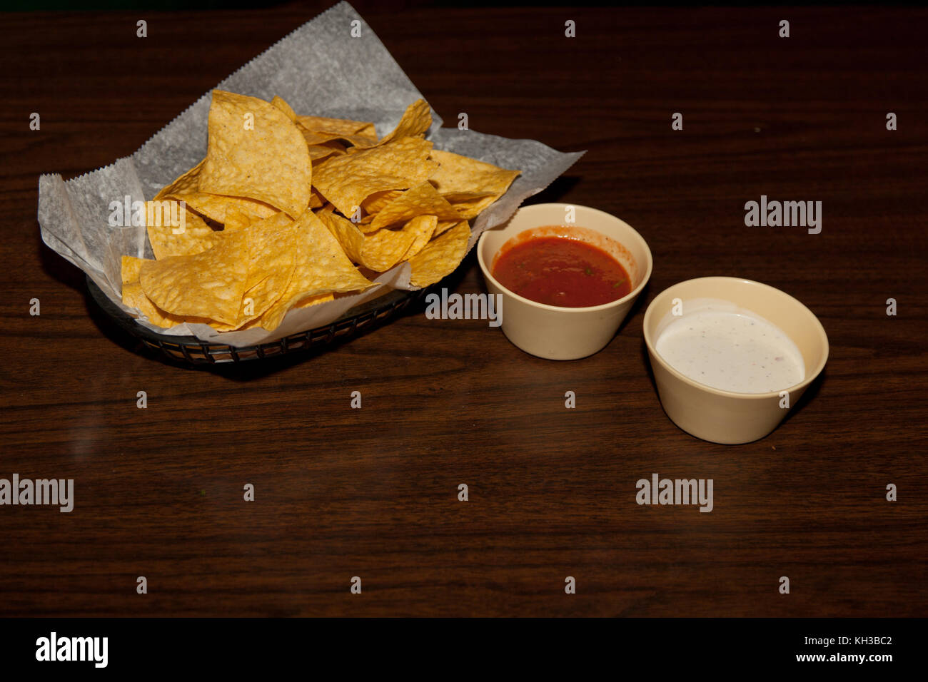 Tostada Chips and two kinds of dip Stock Photo - Alamy