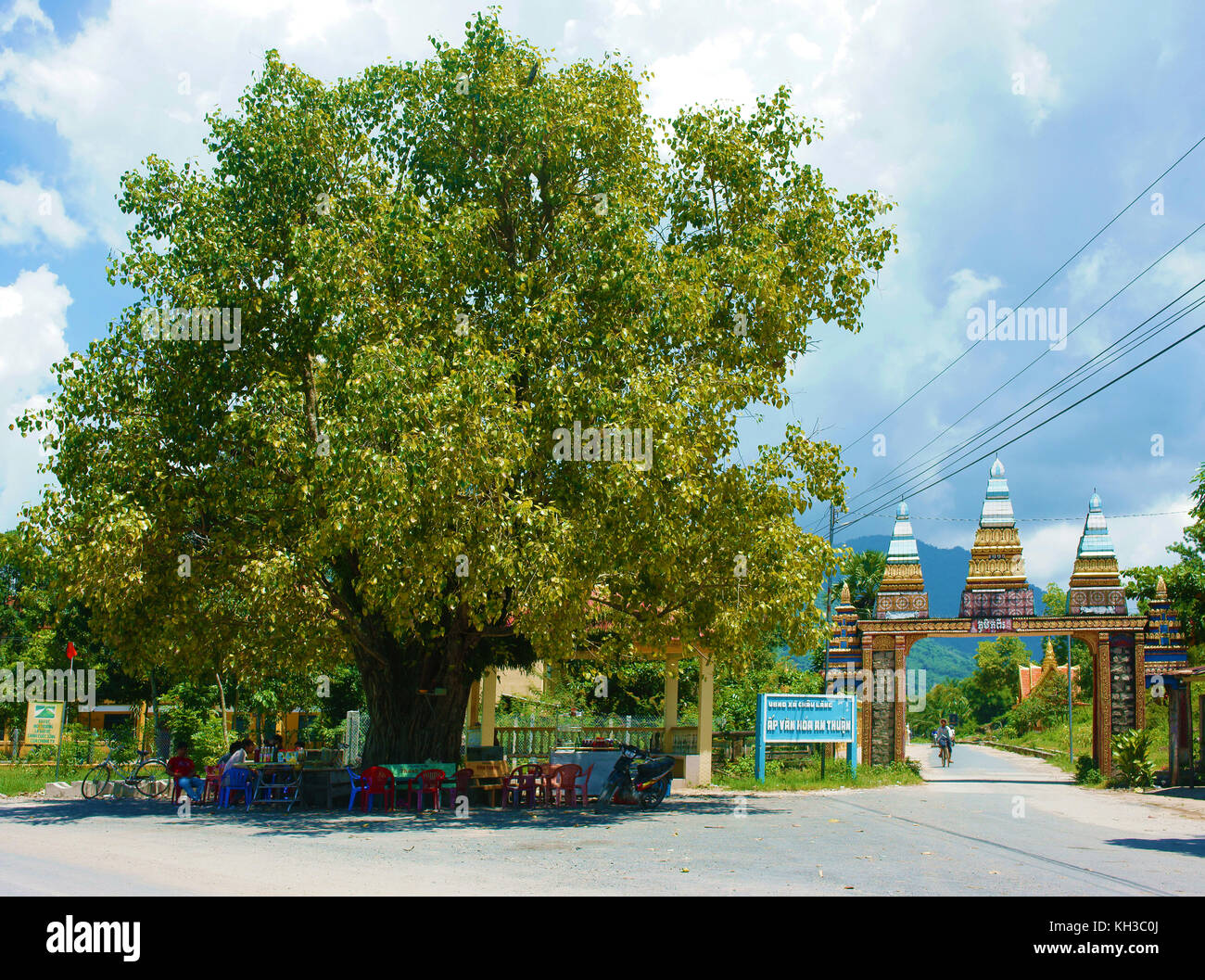AN GIANG, VIET NAM, People have a rest under tree shadow at noon of hot ...