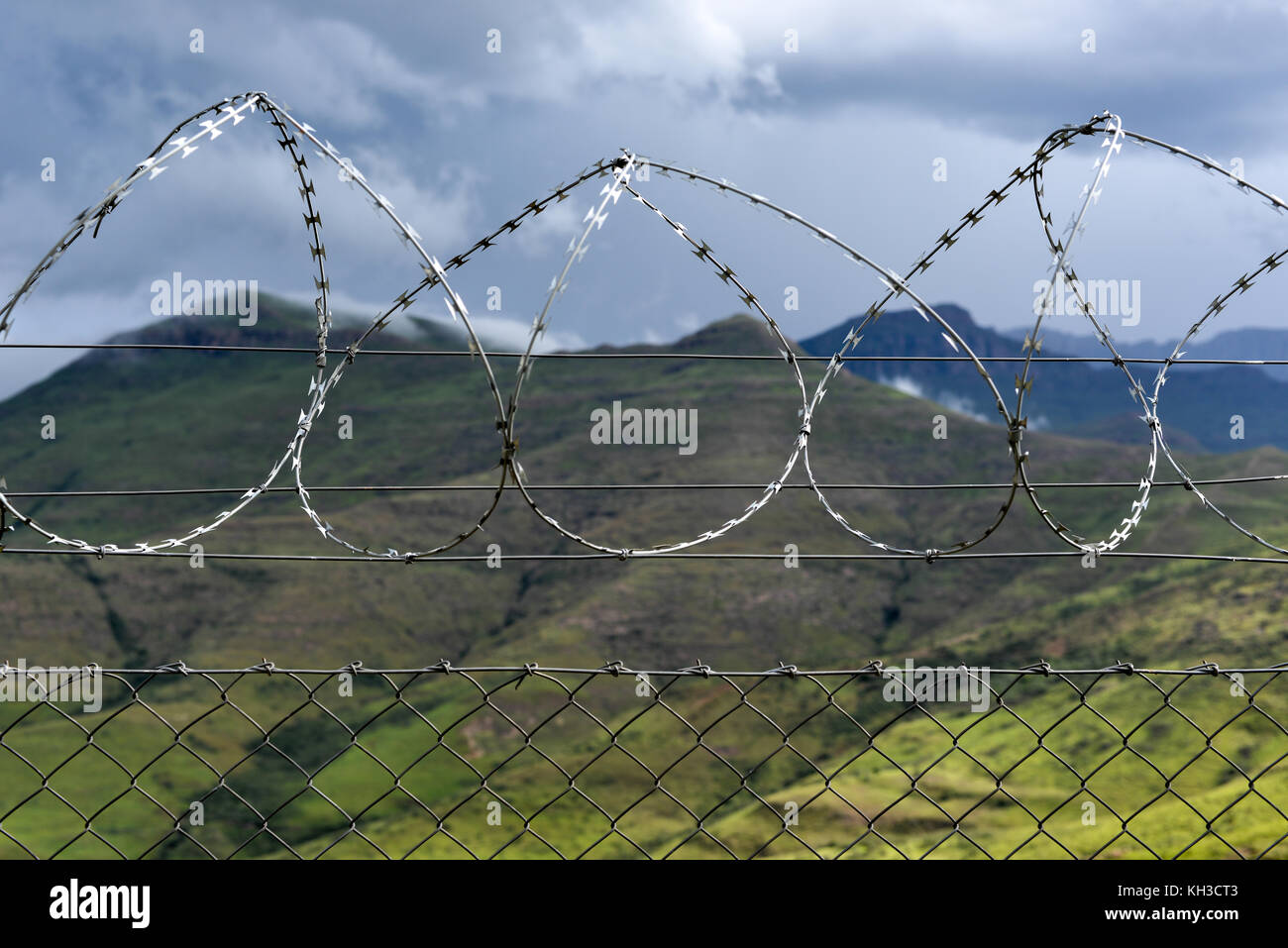 Barbed-wire fence border between South Africa and Lesotho with the ...