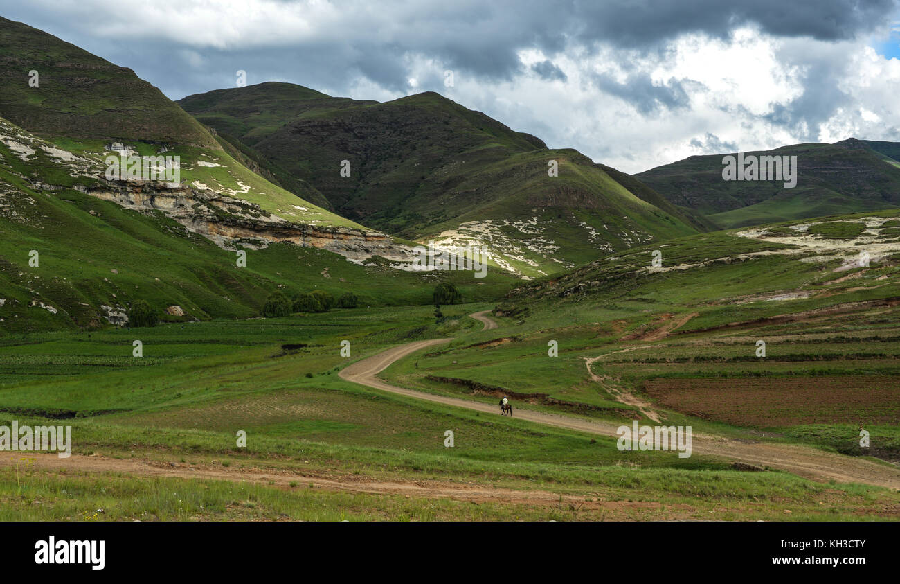 Mounted Sotho Man riding away into Lesotho Landscape. Lesotho ...
