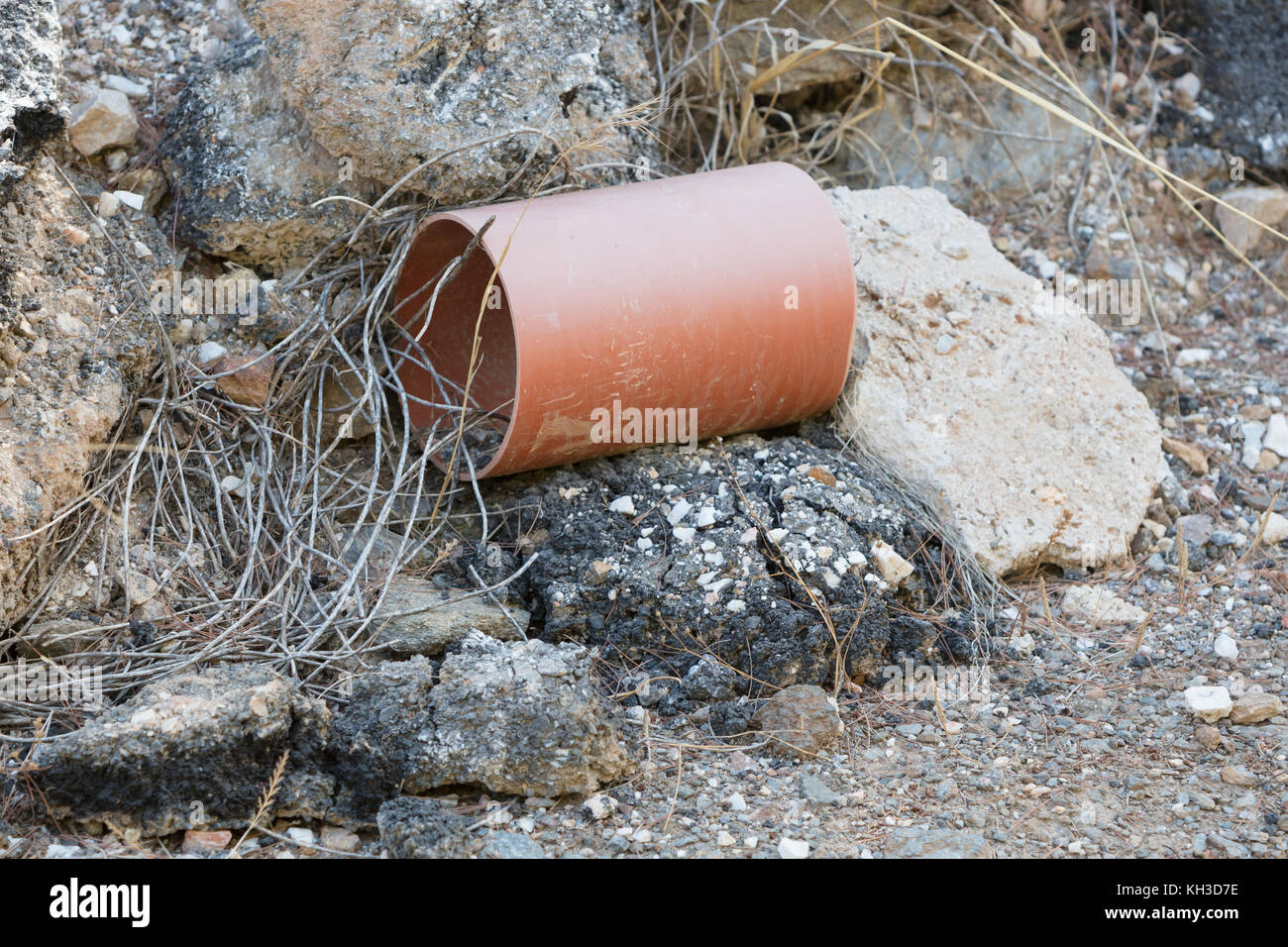 Pollution in Greece - Plastic pipe left in nature Stock Photo - Alamy