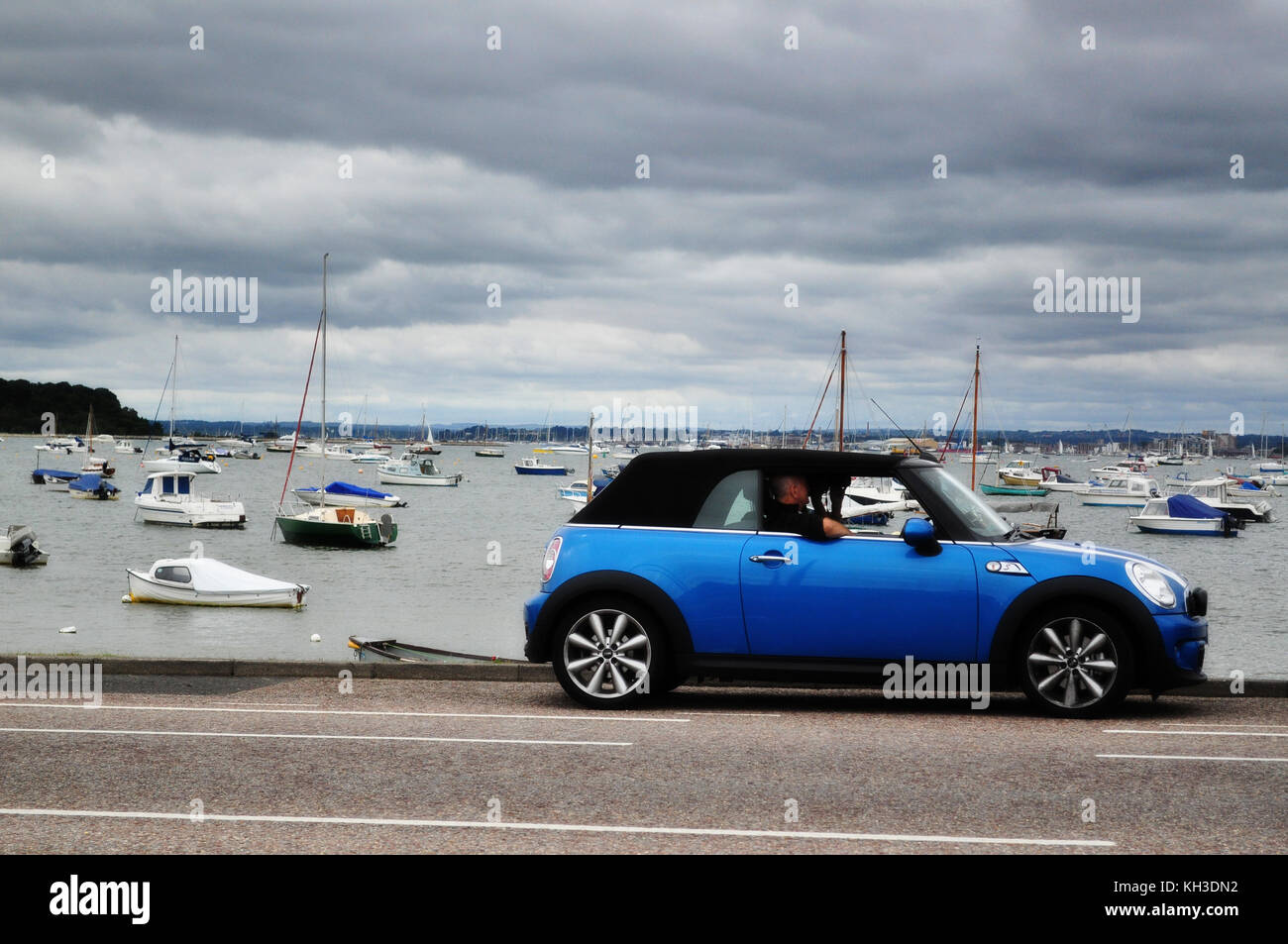 Blue Mini Cooper parked at the beach in Bournmouth, United Kingdom on a ...
