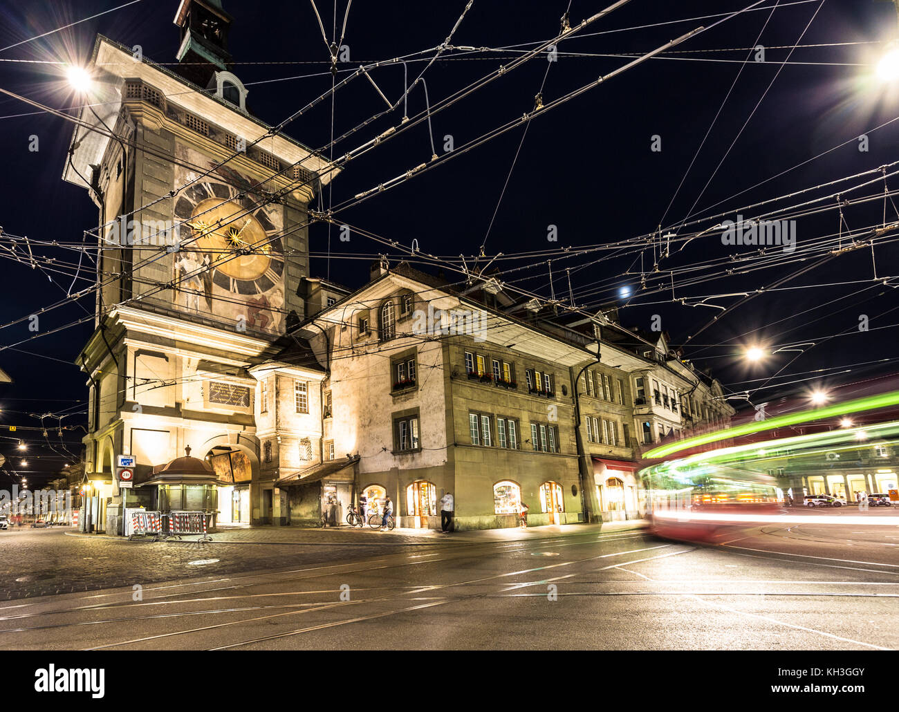 Tram rushes at night in front of the historic Zytglogge (clock tower ...