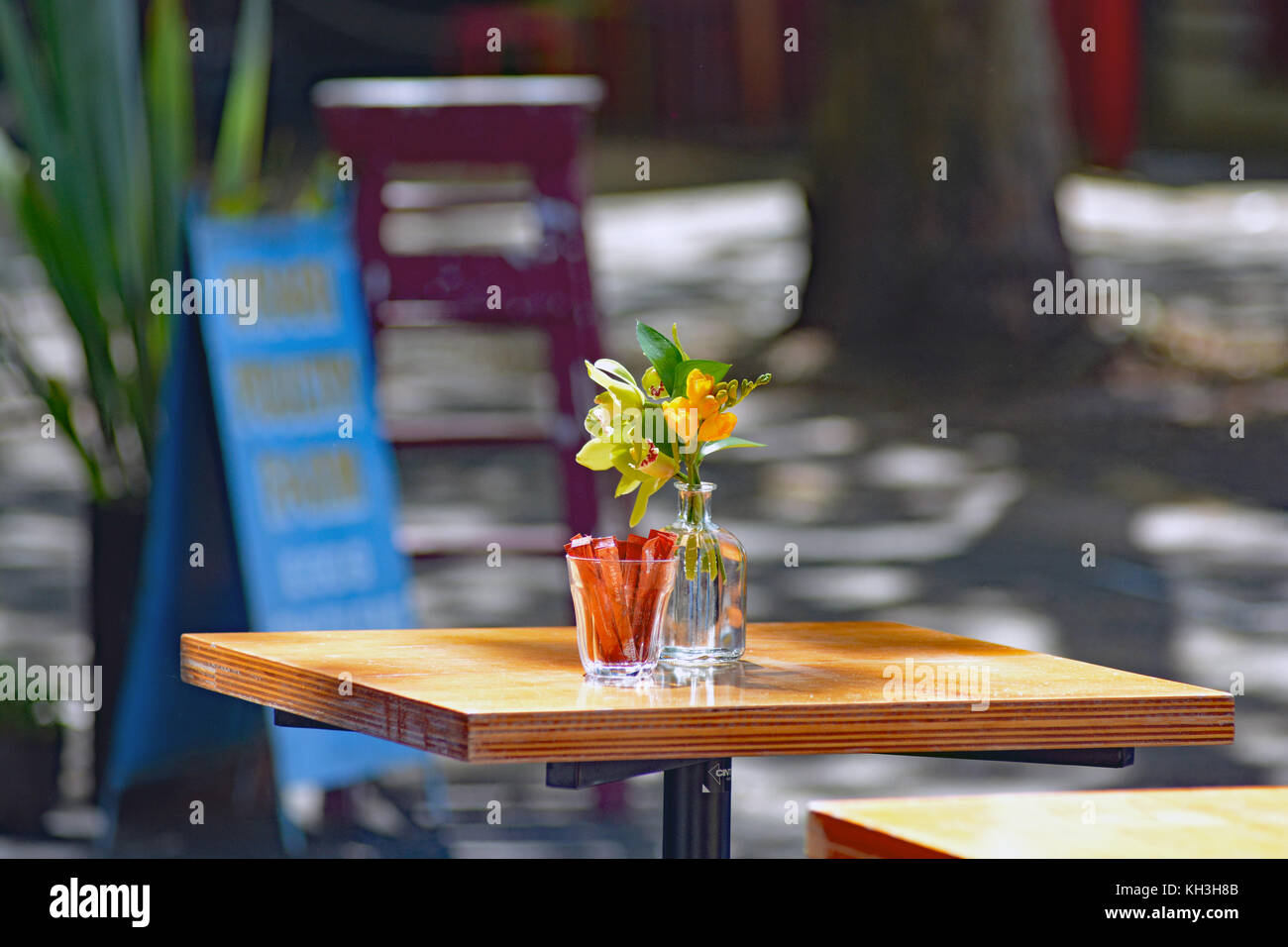 Flowers on a cafe table Stock Photo - Alamy