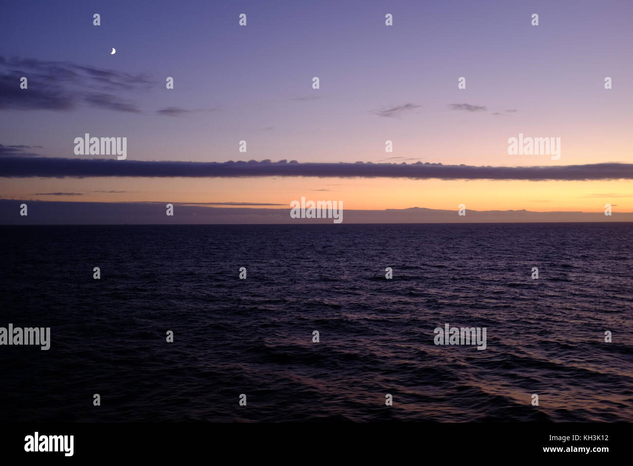 Sunset and moon rise at the Irish sea Stock Photo - Alamy