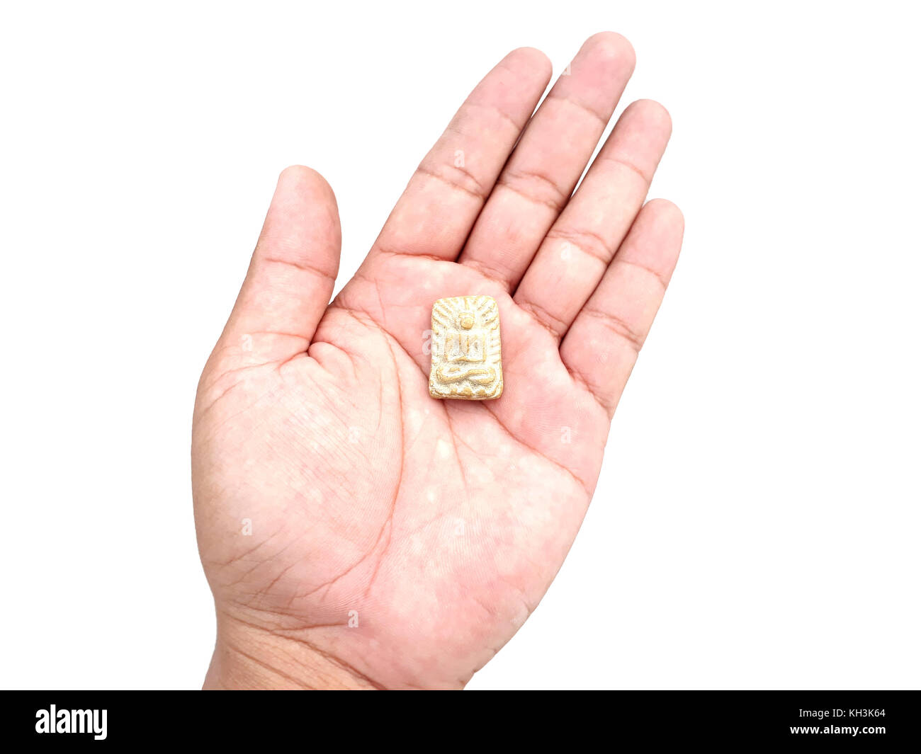 Sacred buddhist clay objects in palm on isolated Stock Photo - Alamy