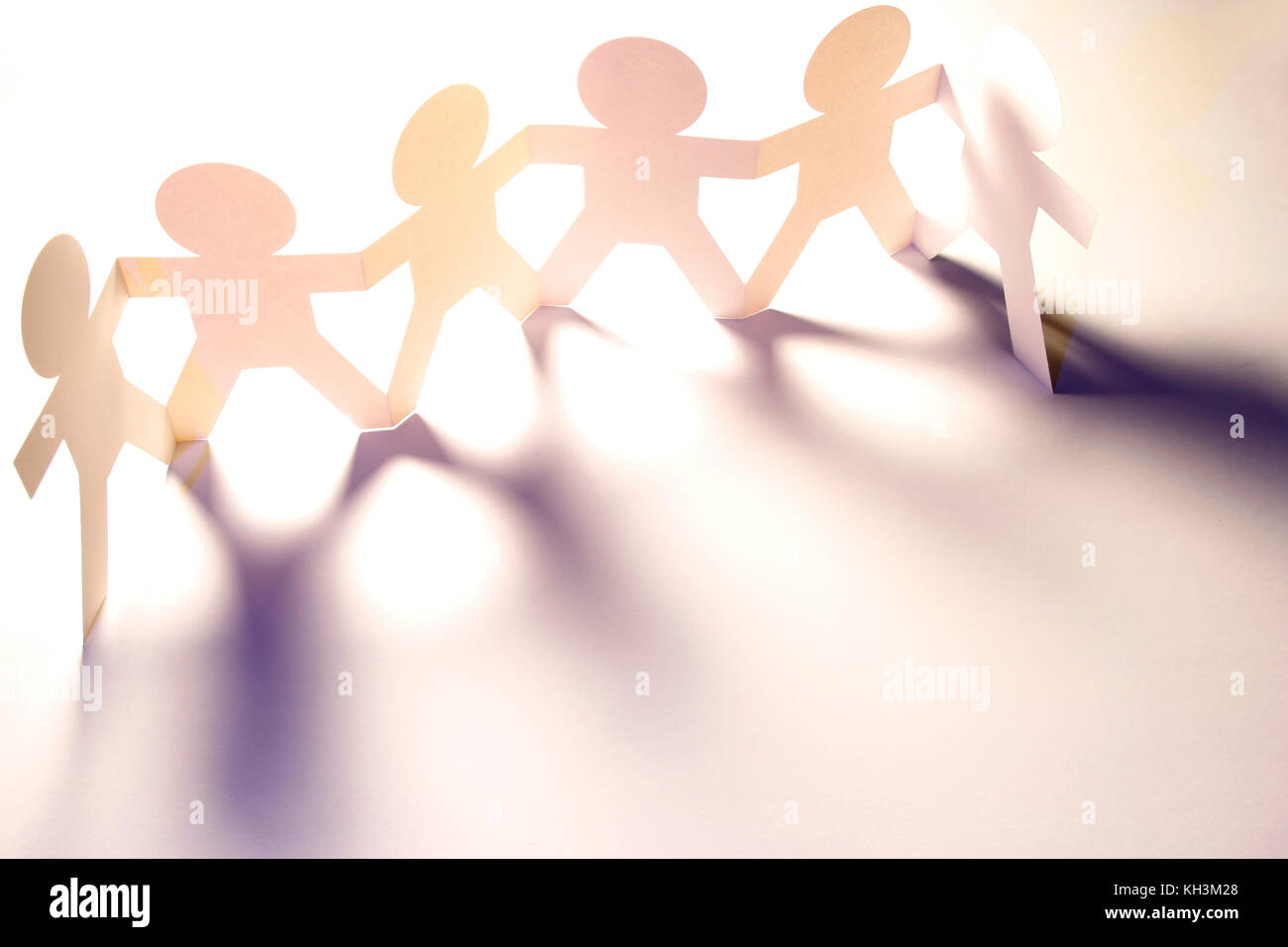 Team of paper chain people Stock Photo - Alamy
