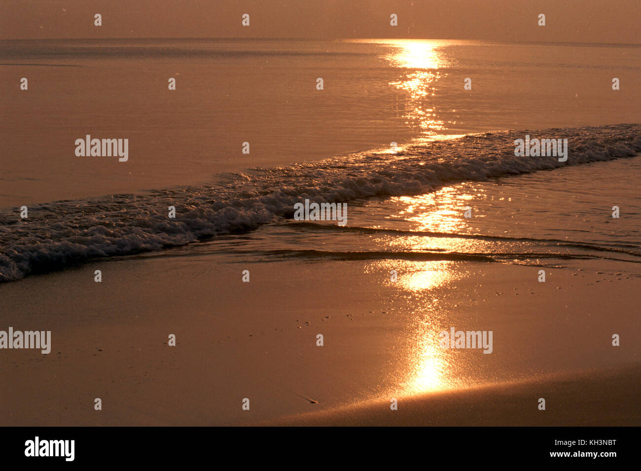 Reddish tinge and golden yellow sunset glow at Radhanagar Beach ...