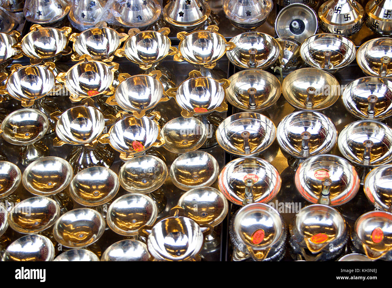 Display of polished brass oil lamp pots at a store Stock Photo - Alamy