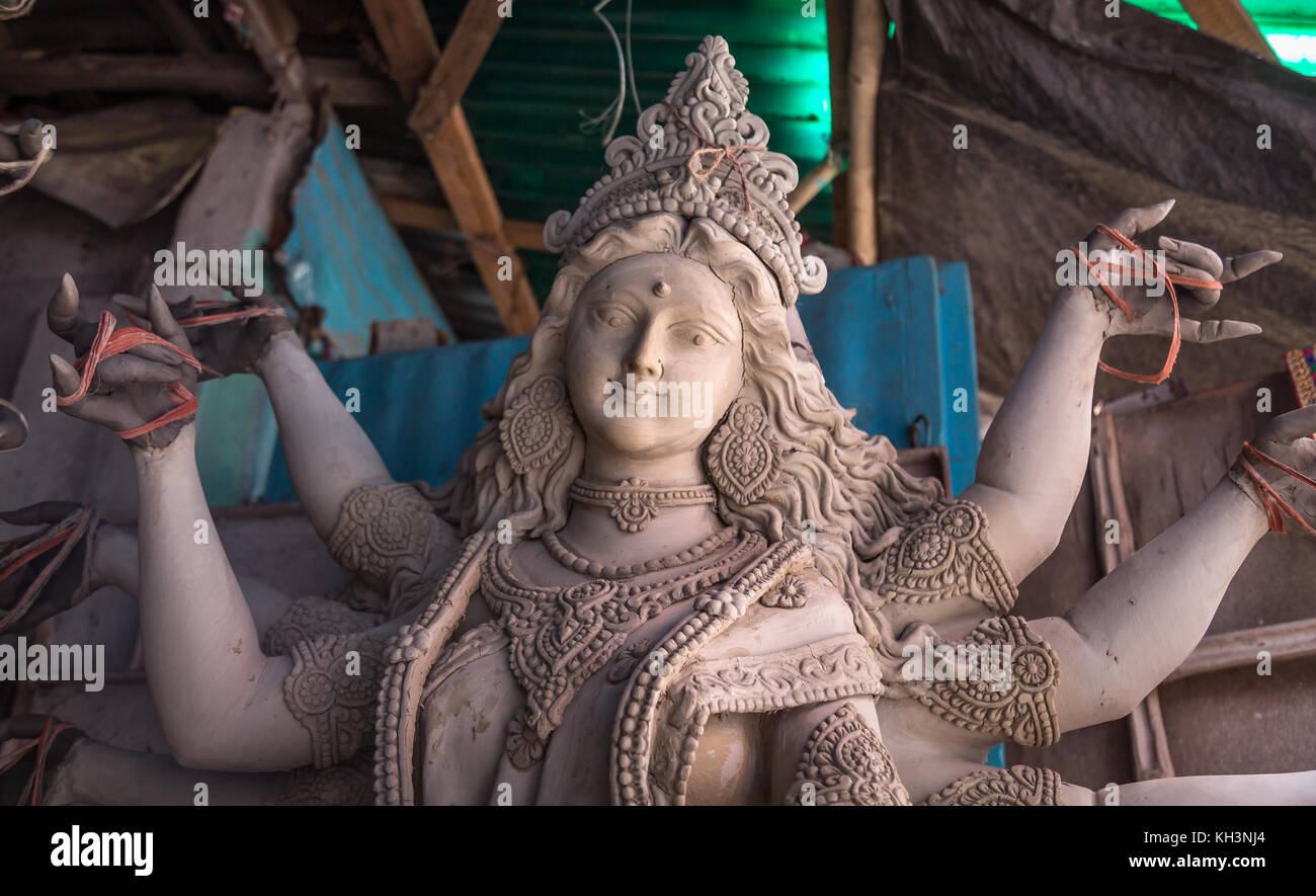 Unfinished clay Durga idol at a local artisan studio at the Kumartuli ...