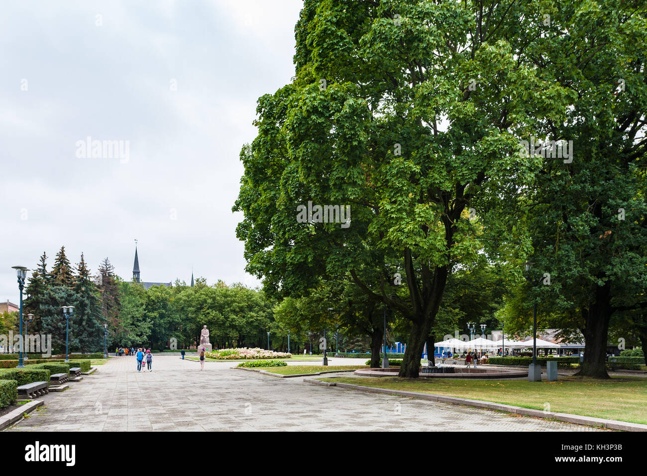 RIGA, LATVIA - SEPTEMBER 3, 2017: people walk in urban Esplanade park ...