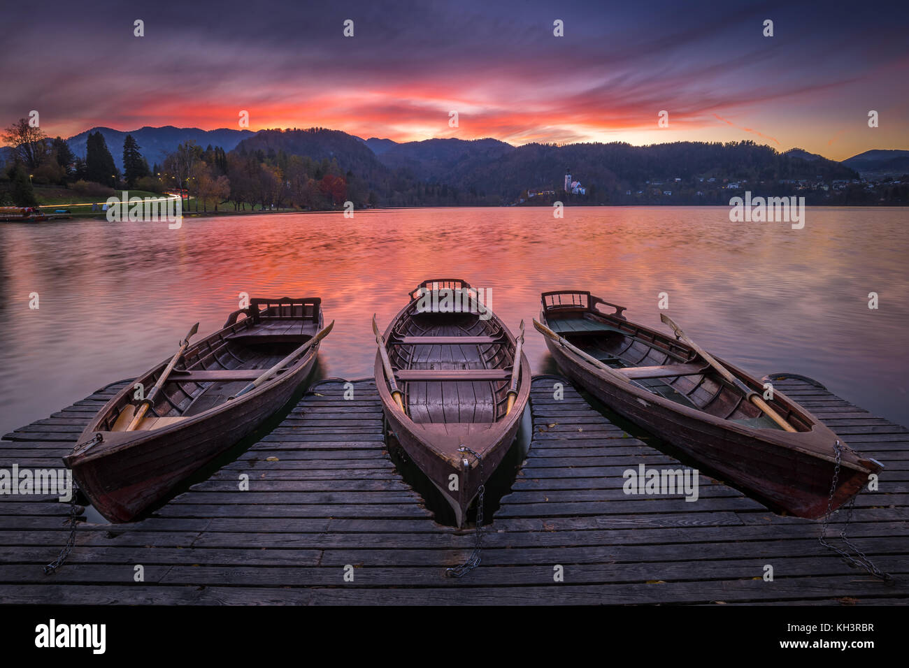 Bled, Slovenia - Traditional boats at Lake Bled with beautiful dramatic ...