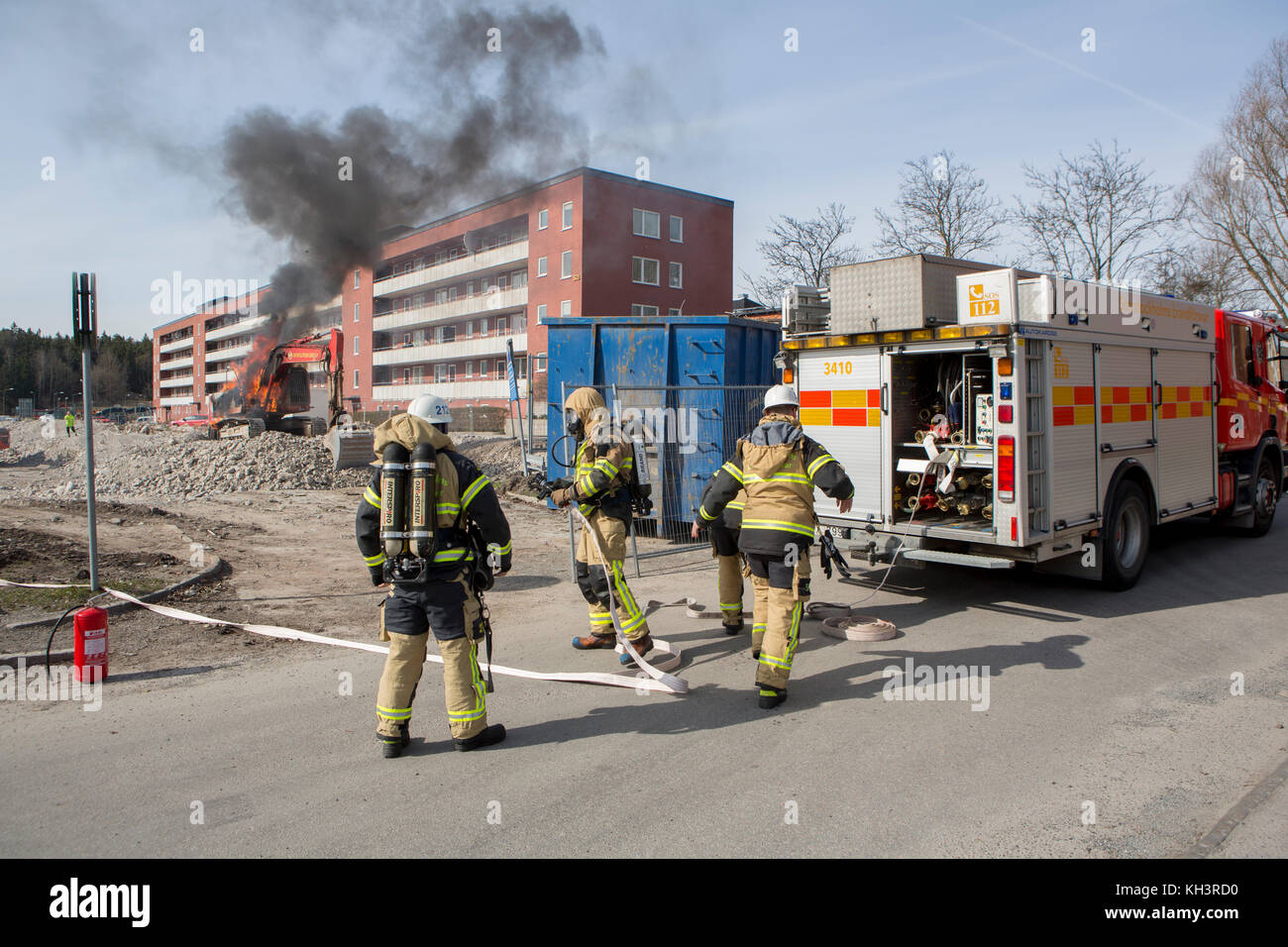 Rescue personnel at a fire, Rinkeby, Sweden Stock Photo - Alamy
