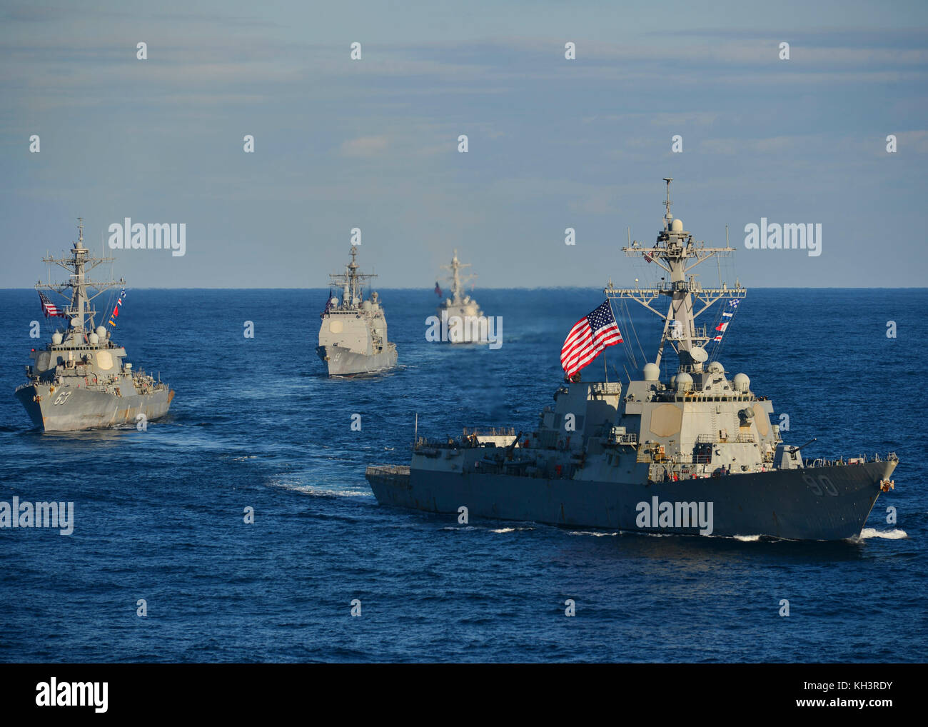 The guided-missile destroyer USS Chafee (DDG 90), right, leads USS ...