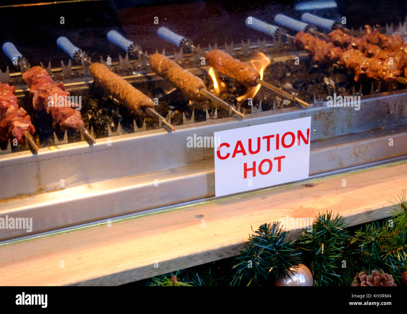 Caution Hot sign on a market food stall Stock Photo - Alamy
