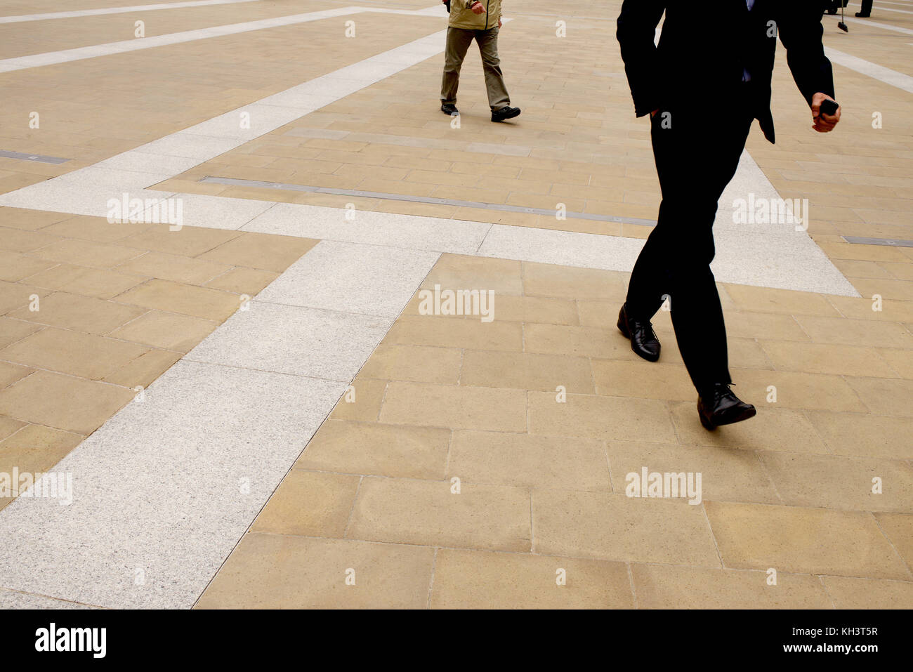 Detail of pavement and people walking Stock Photo - Alamy