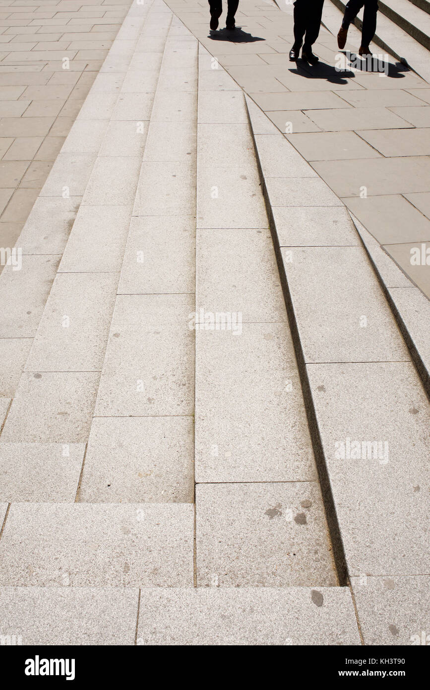 Detail of pavement and people walking Stock Photo - Alamy
