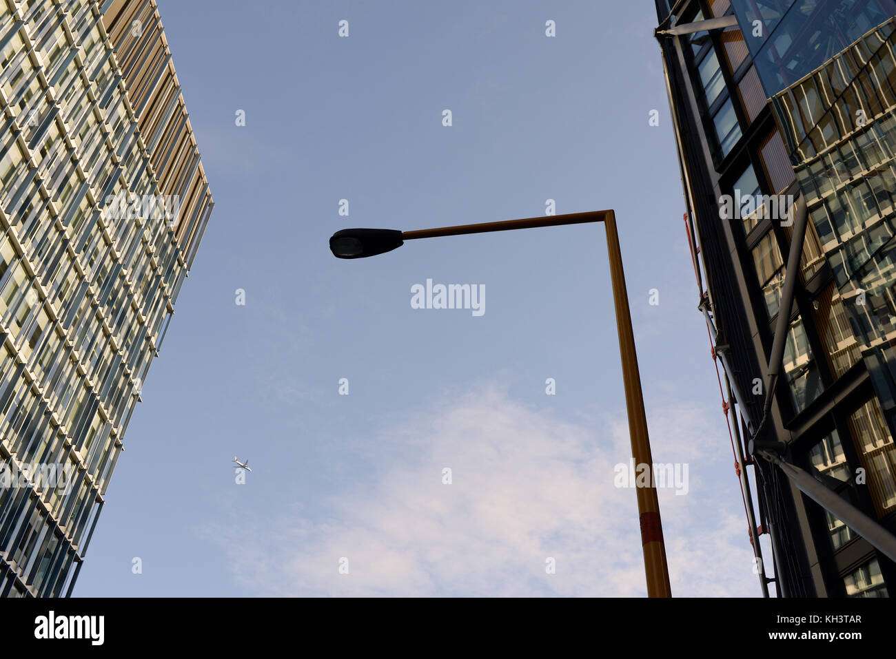 Jet aircraft between two hi-rise buildings in London Stock Photo - Alamy