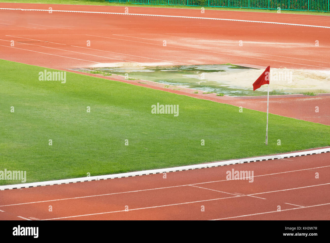 Soccer field with red flag on conner Stock Photo - Alamy
