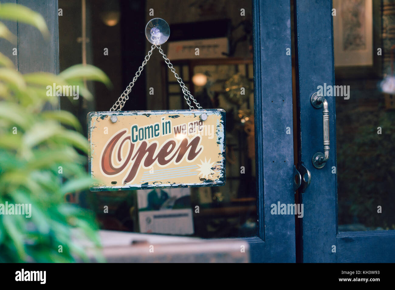 Open signboard on shop door Stock Photo - Alamy
