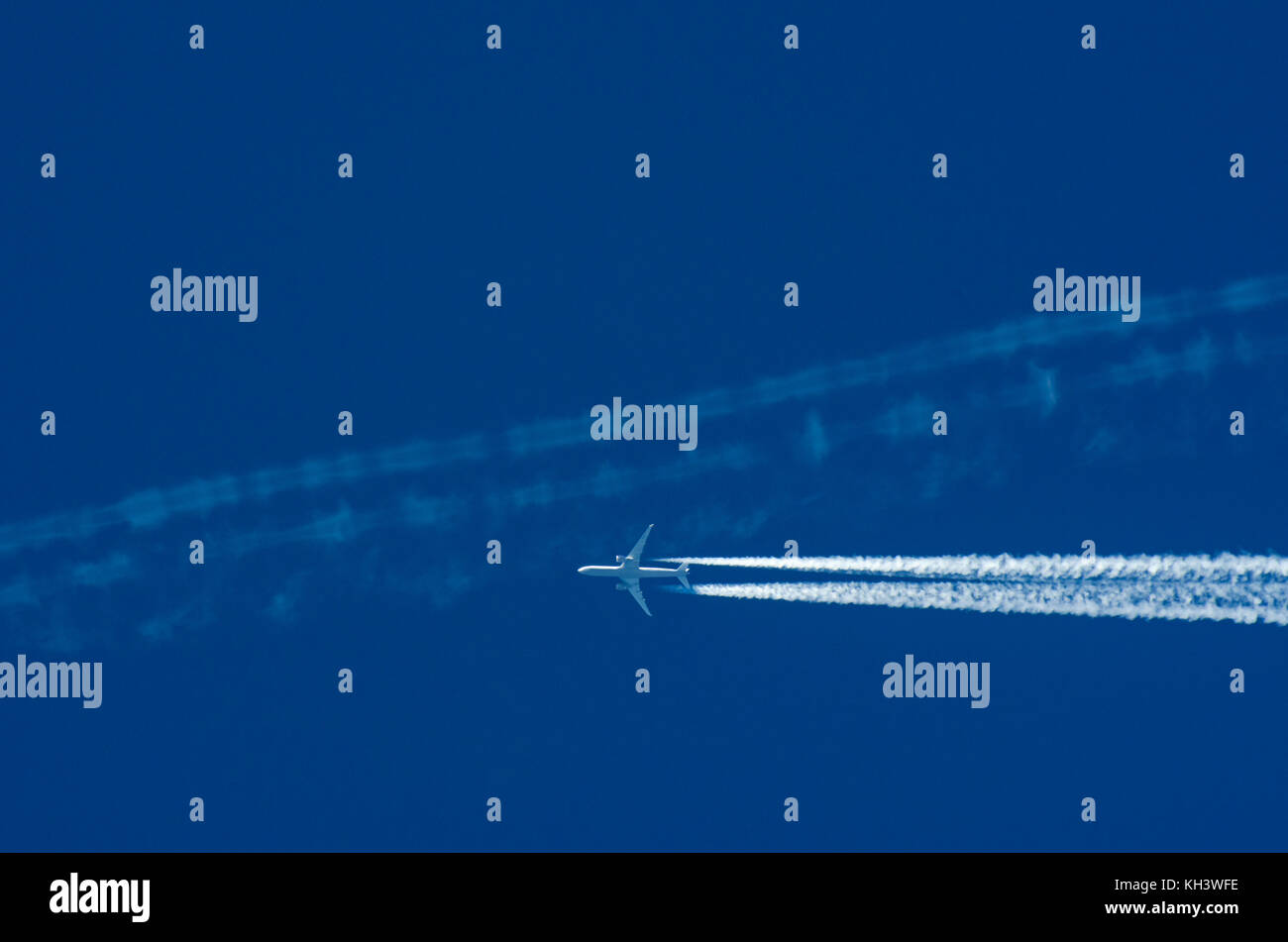 Transportation competition concept: a jet airplane crossing other plane ...
