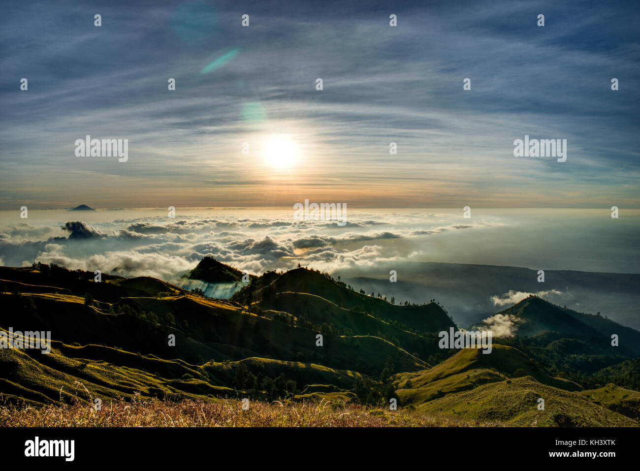 Sunset over Clouds mountain top vulcano Rinjani Lombok Indonesia Stock ...